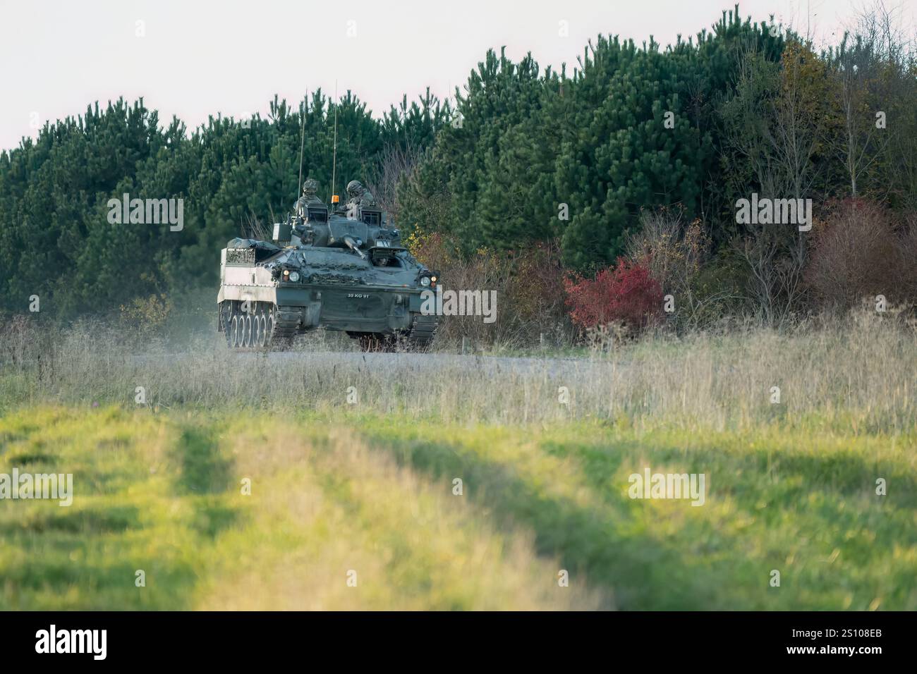 commander and gunner directing a British army Warrior FV510 IFV in ...