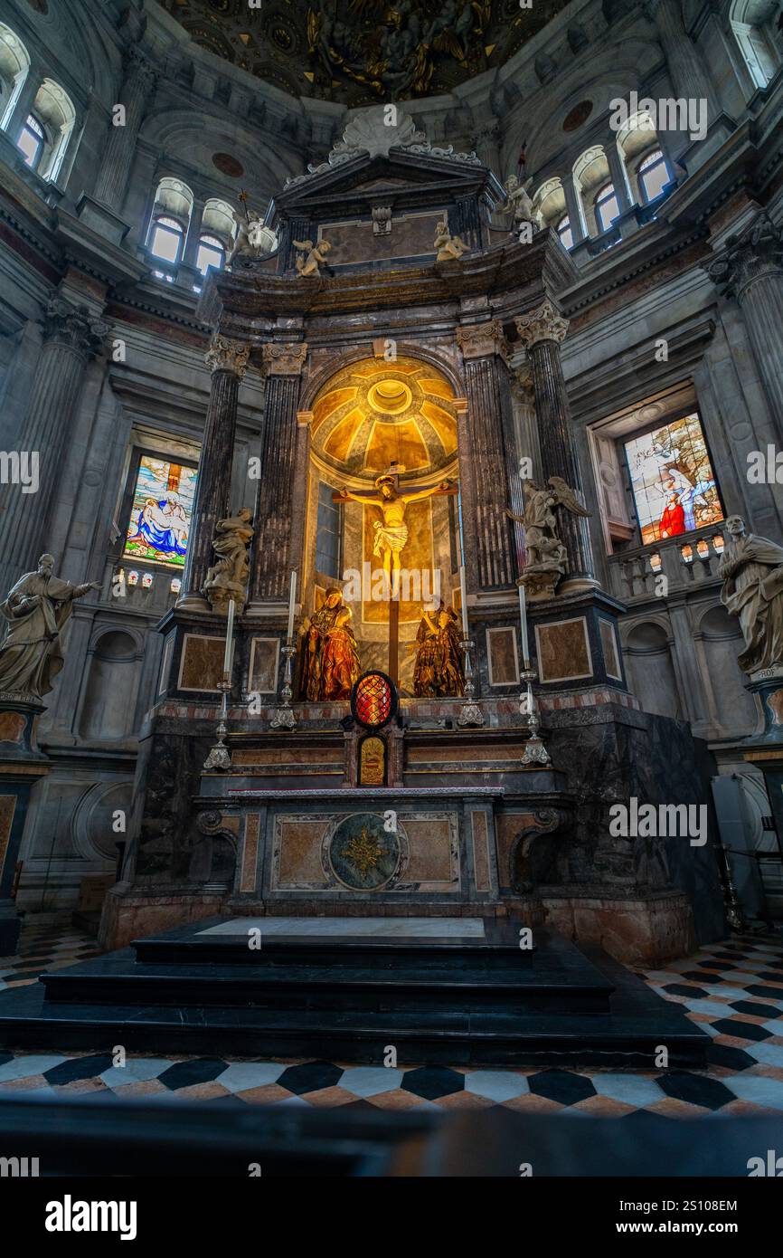 A beautifully ornate church altar with a golden crucifix centerpiece ...