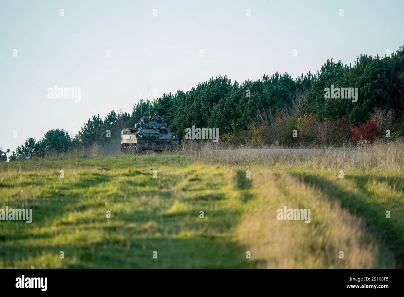 commander and gunner directing a British army Warrior FV510 IFV in ...