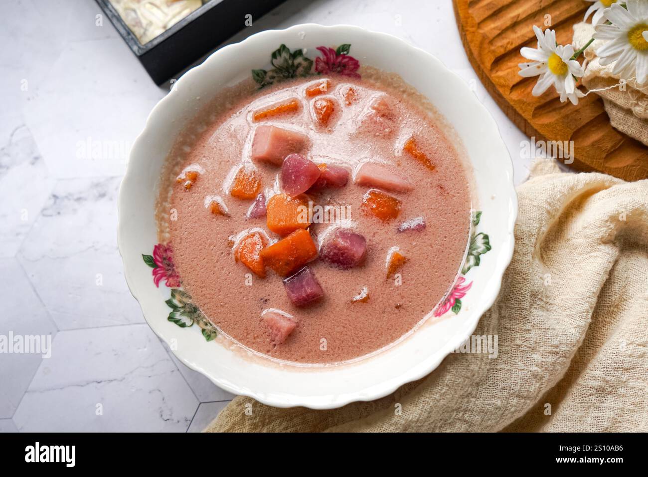 Bubur Cha Cha is a creamy coconut dessert with colorful cubes of purple ...