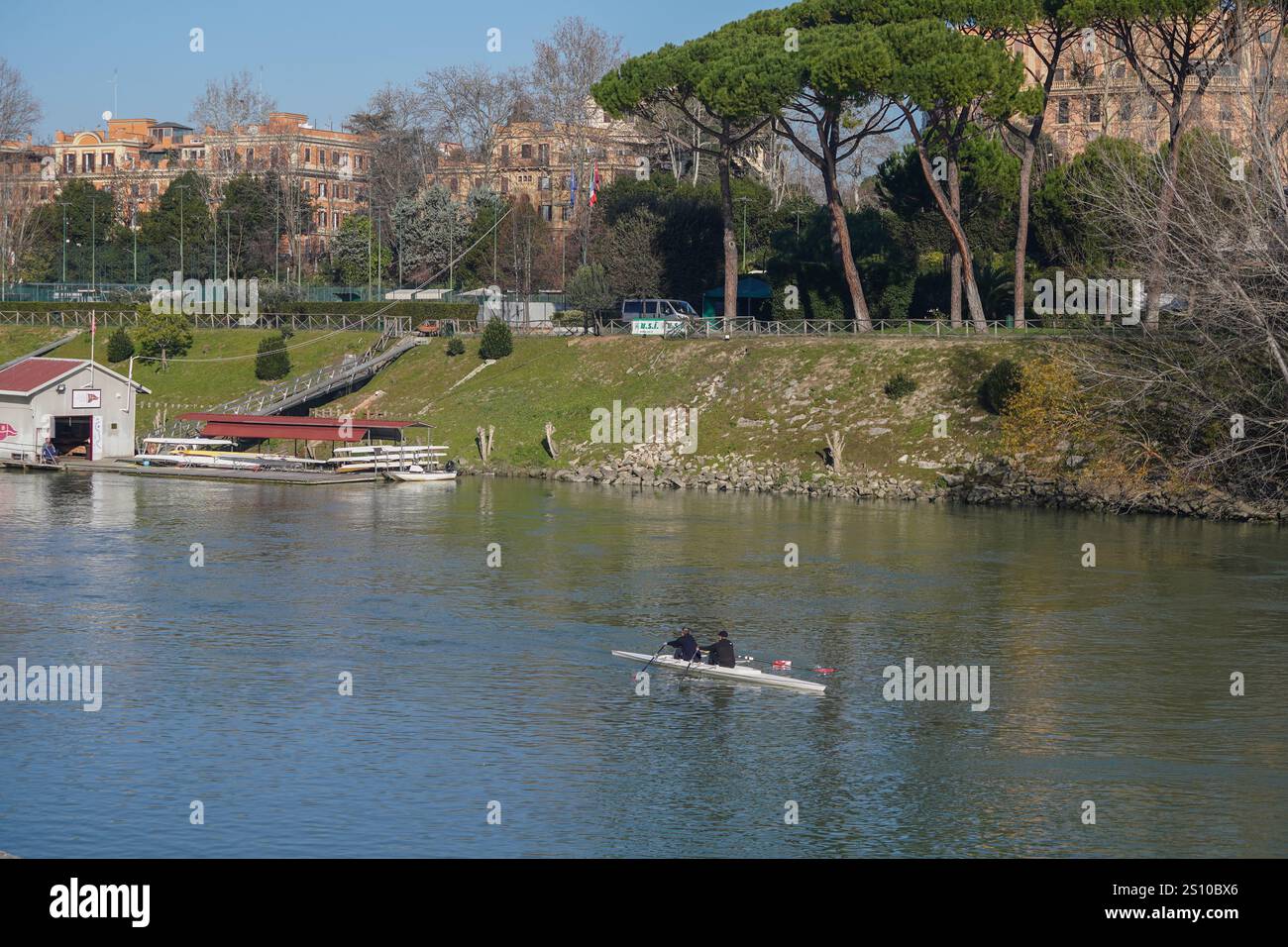 Rome, Italy. 30 December 2024 A rowing crew exercising in the warm ...