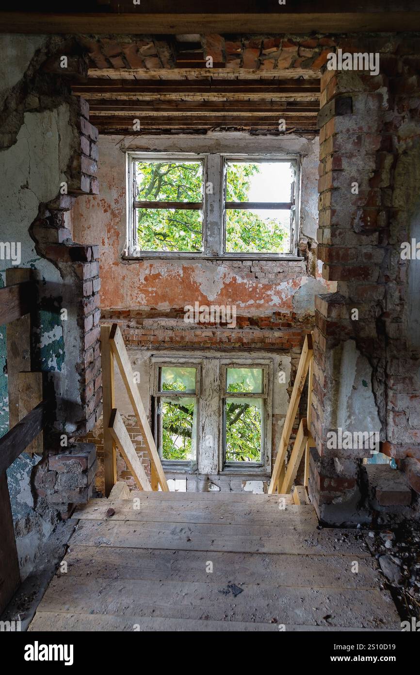 Damaged windows of an old abandoned mansion Stock Photo - Alamy