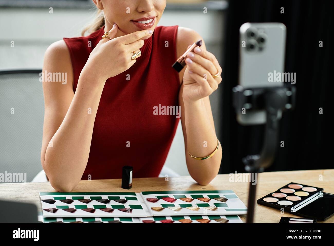 Young influencer engages her audience by demonstrating stylish beauty ...