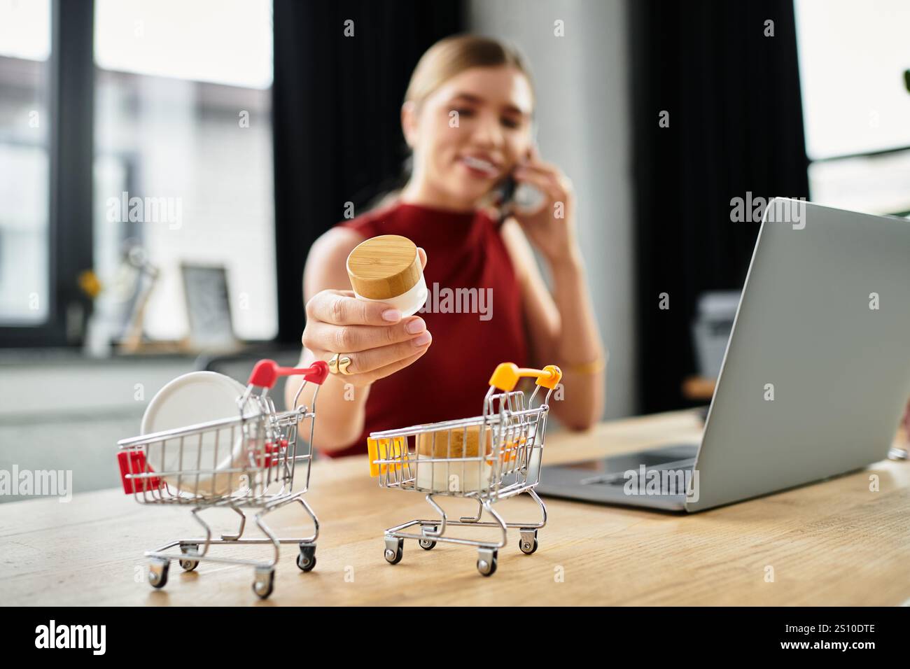 Attractive young woman promoting beauty products from her home office ...