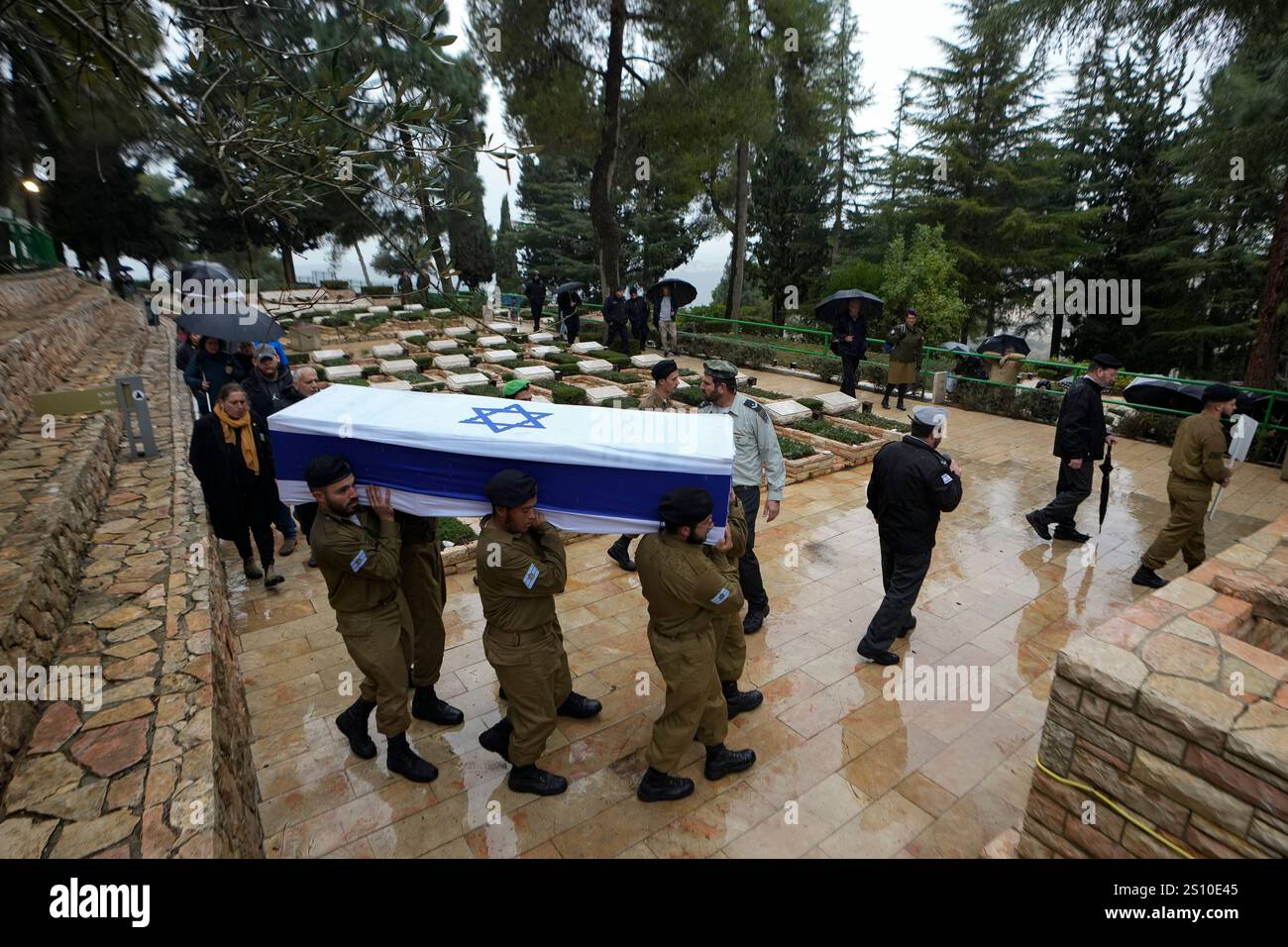 Israeli soldiers carry the flag-draped casket of 1st Sgt. Yuval Shoham ...
