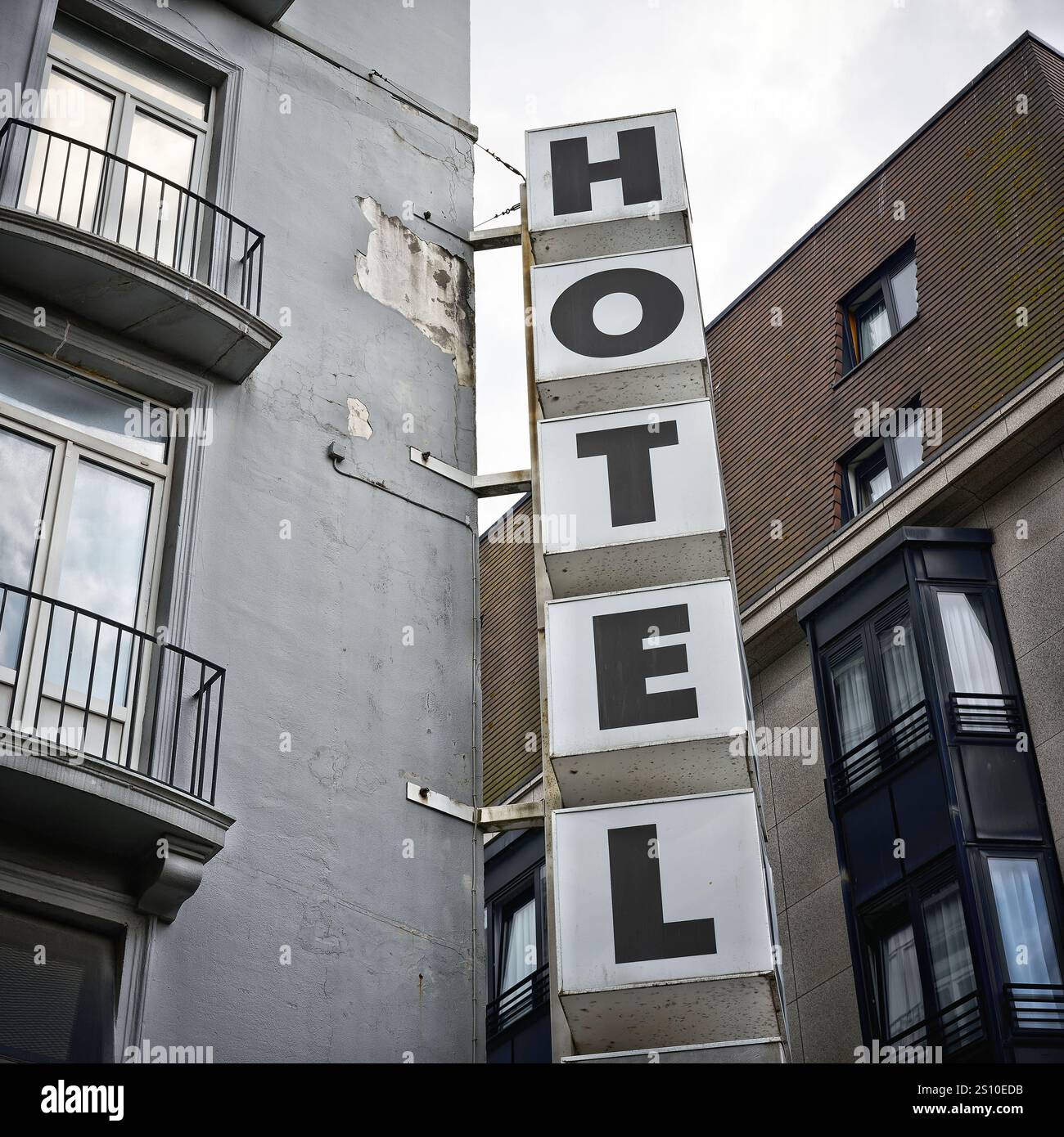 Advertising sign of a somewhat run-down hotel in Belgium Stock Photo ...