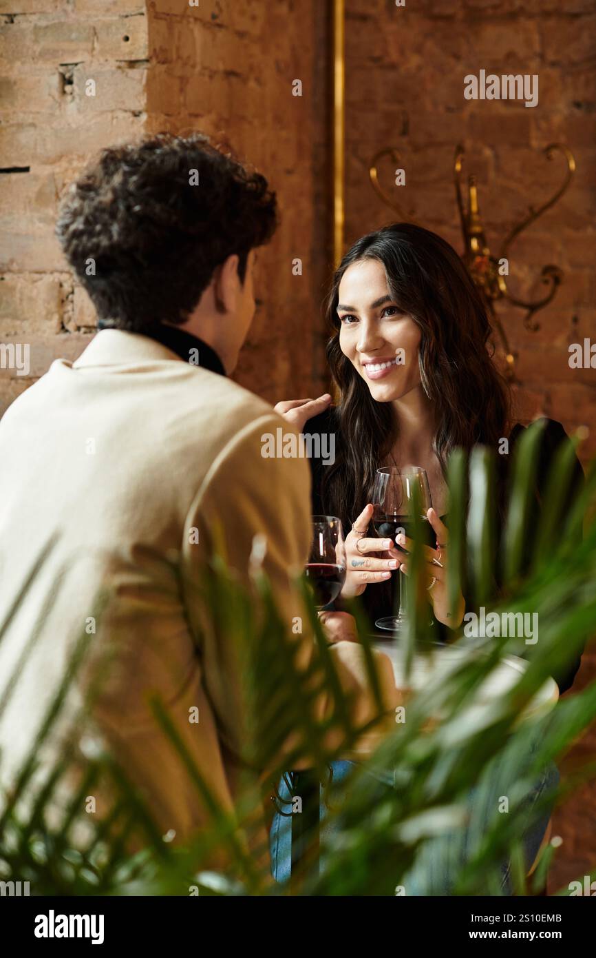 A beautiful couple enjoys each others company while celebrating love in ...