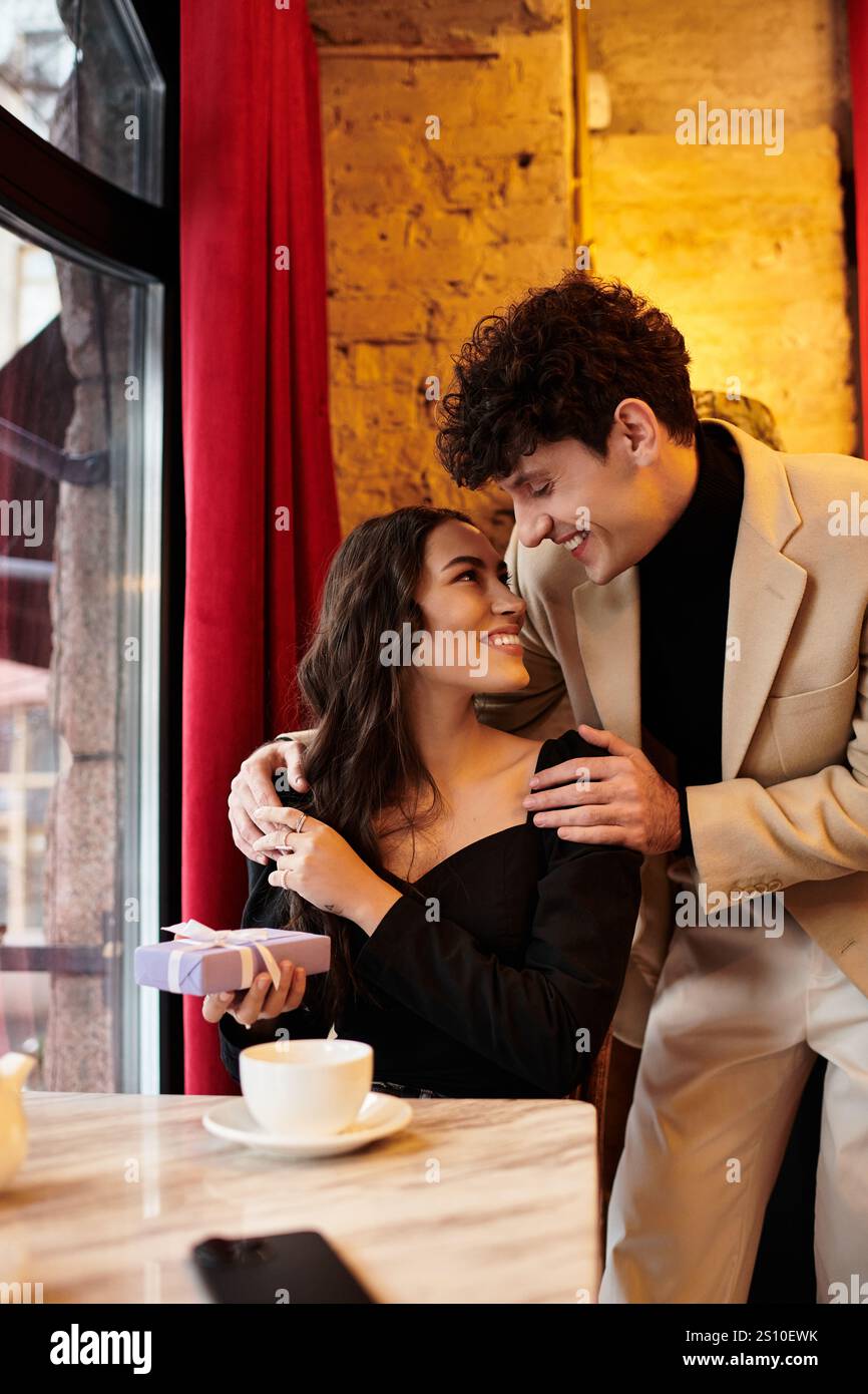 A young couple shares a romantic moment while celebrating their love ...