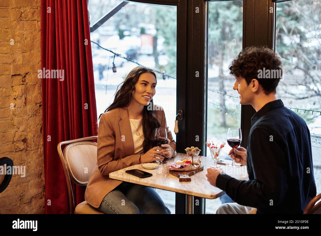A delightful couple enjoys each other's company while celebrating ...