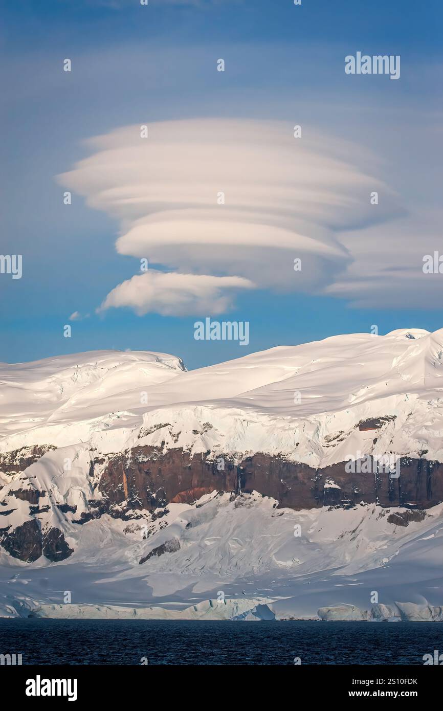 view of lenticular clouds over Waterboat Point, with ice capped ...