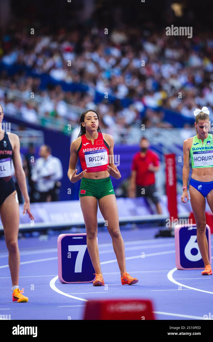 Assia Raziki participating in the 800 meters at the Paris 2024 Olympic ...