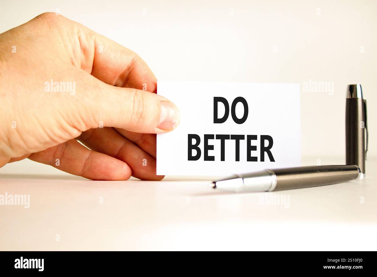 Do better symbol. Concept words Do better on beautiful white card ...