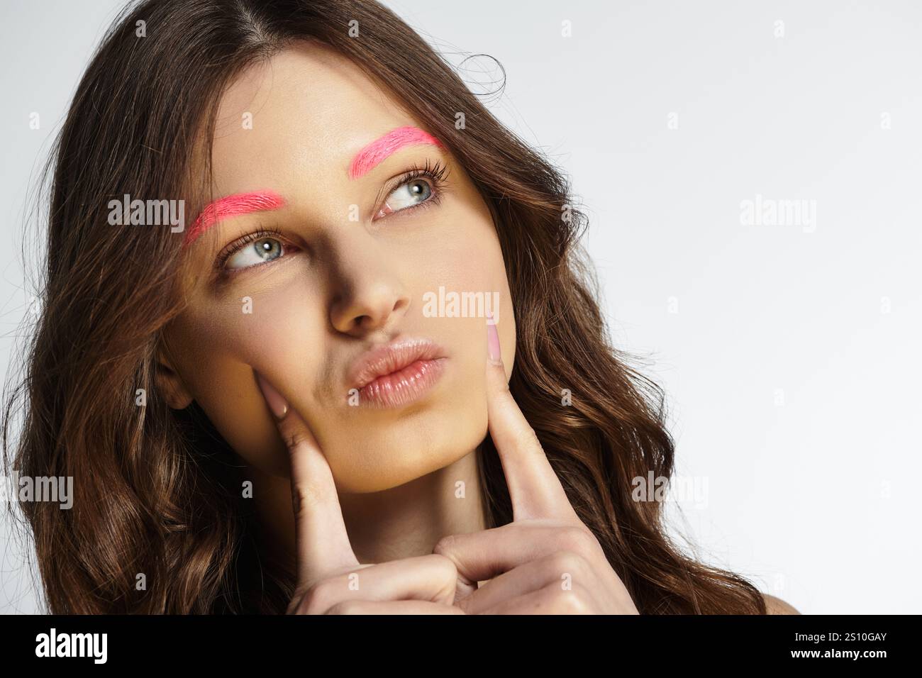Young woman flaunts her striking pink eyebrows and confident style ...