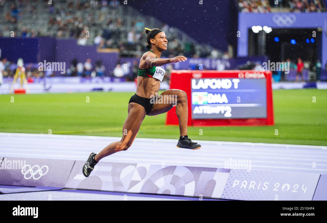 Thea LaFond participating in the triple jump at the Paris 2024 Olympic ...