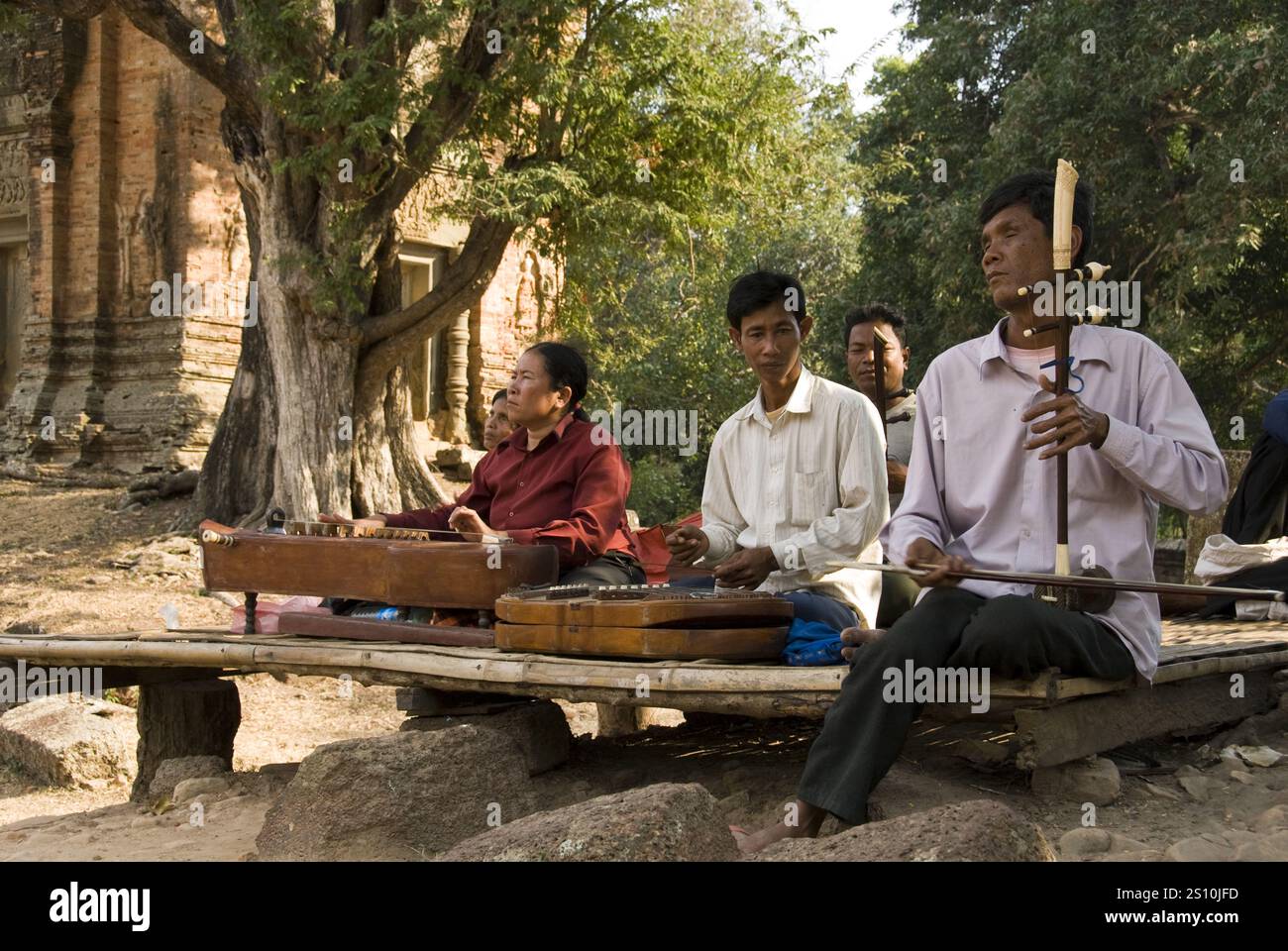 Musicians play near Bakong temple built by the Khmer empire at Angkor ...