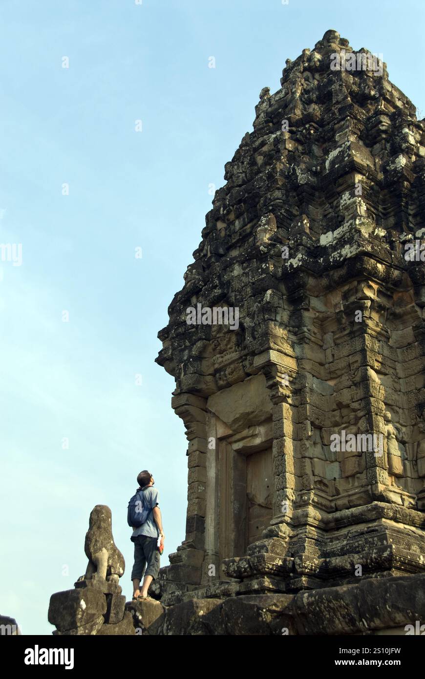 A tourist explores the Bakong temple built by the Khmer empire at ...
