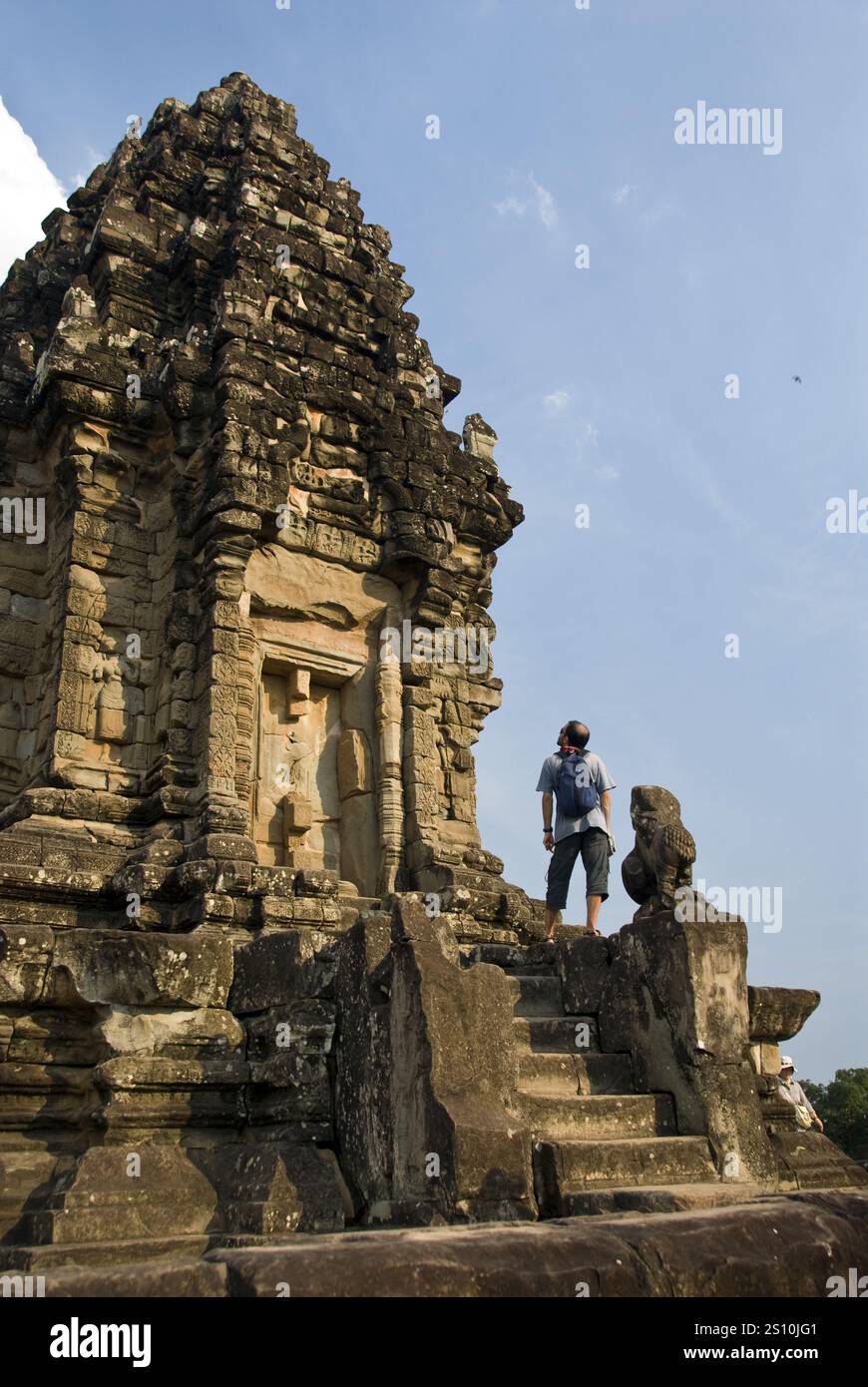 A tourist explores the Bakong temple built by the Khmer empire at ...
