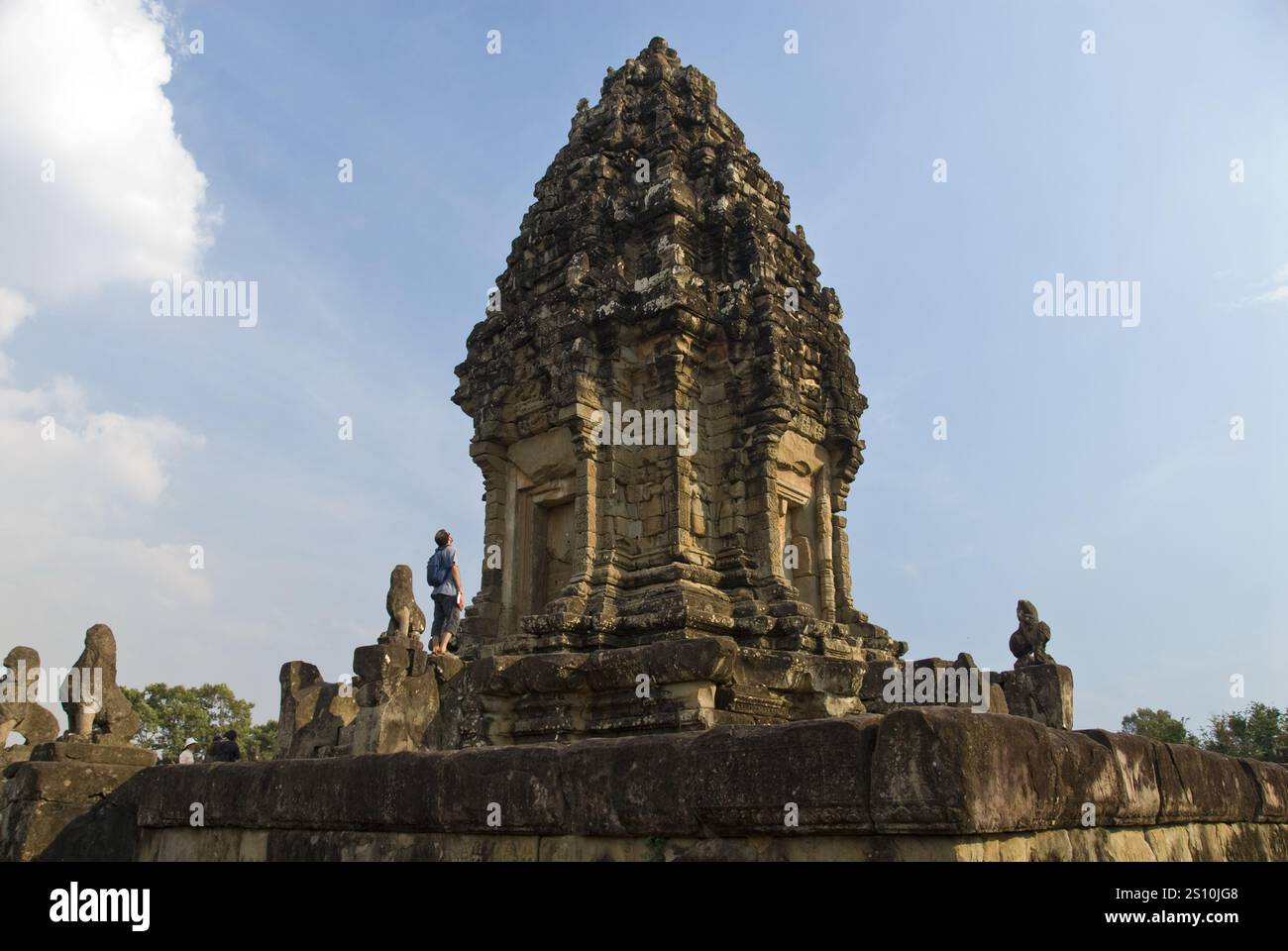 A tourist explores the Bakong temple built by the Khmer empire at ...