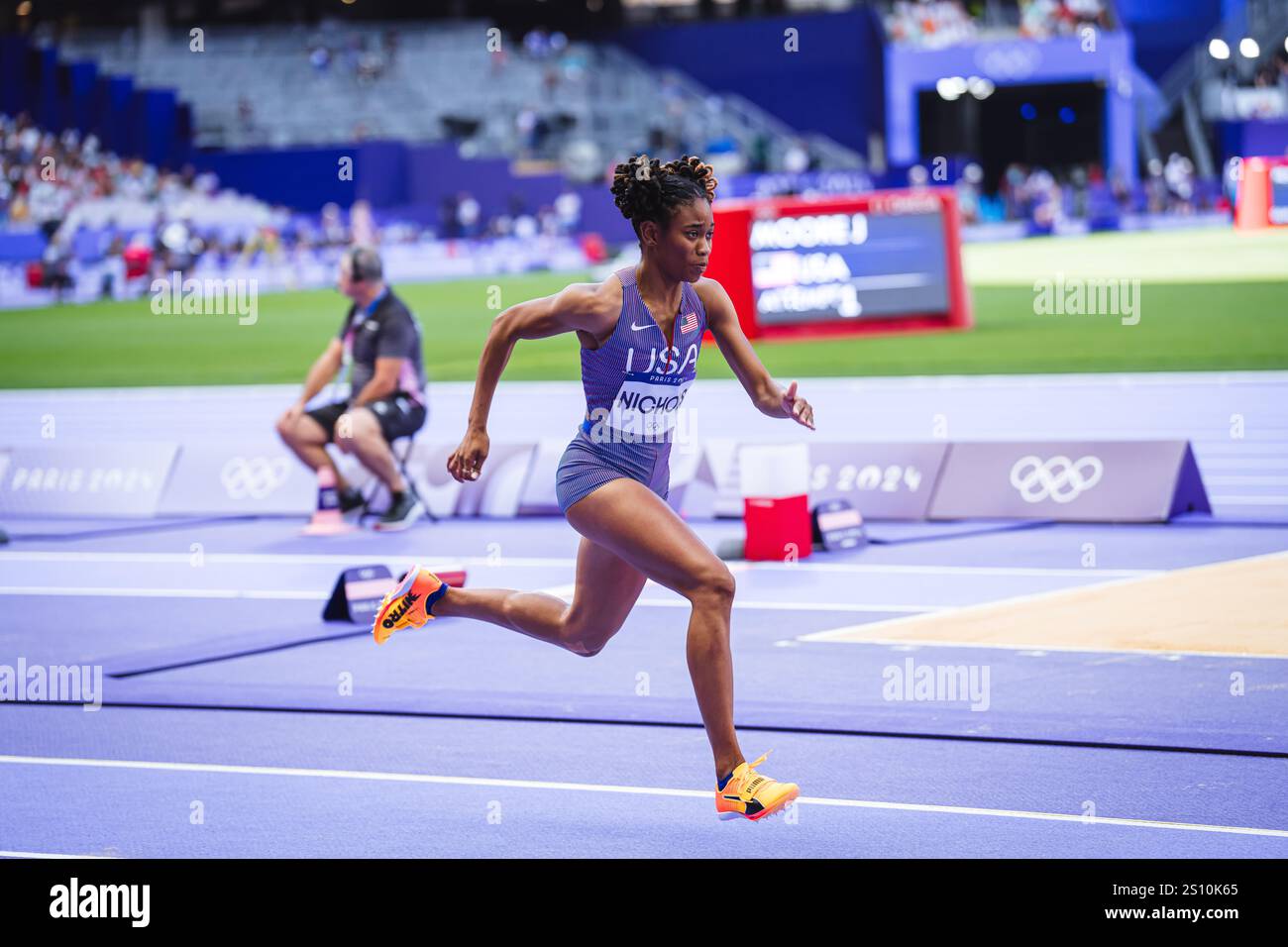 Monae' Nichols participating in the long jump at the Paris 2024 Olympic ...