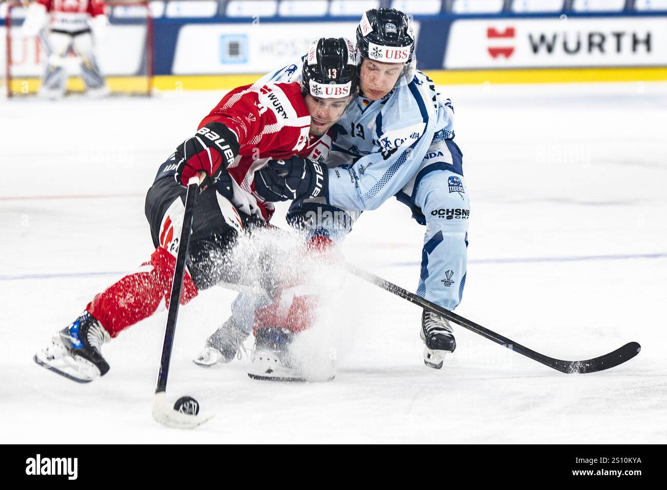 Team Canada's Manix Landry, left, fights for the puck against Straubing ...