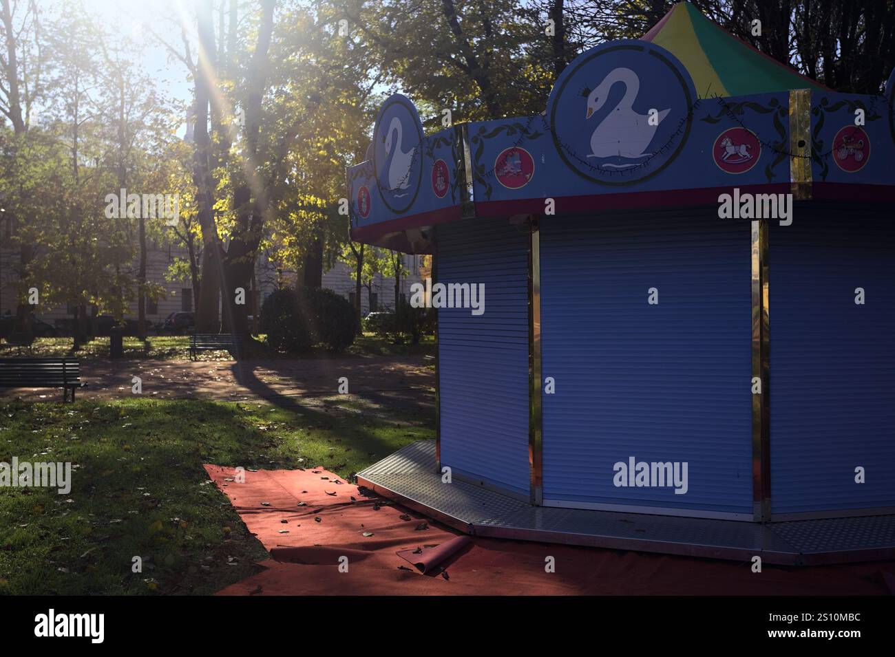 Closed game stall in a park during daytime counterlit by the sun Stock ...