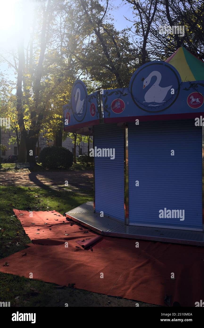 Closed game stall in a park during daytime counterlit by the sun Stock ...