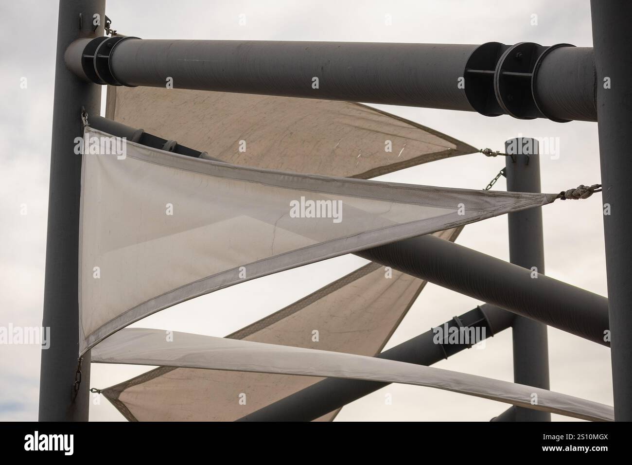 Several triangular fabric canopies attached to a metal structure Stock ...