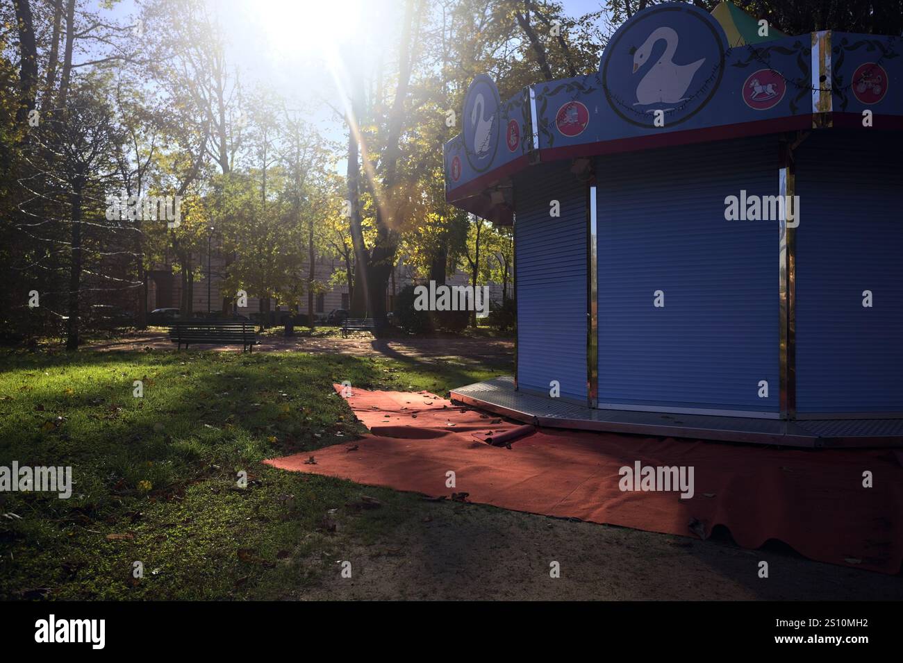 Closed game stall in a park during daytime counterlit by the sun Stock ...