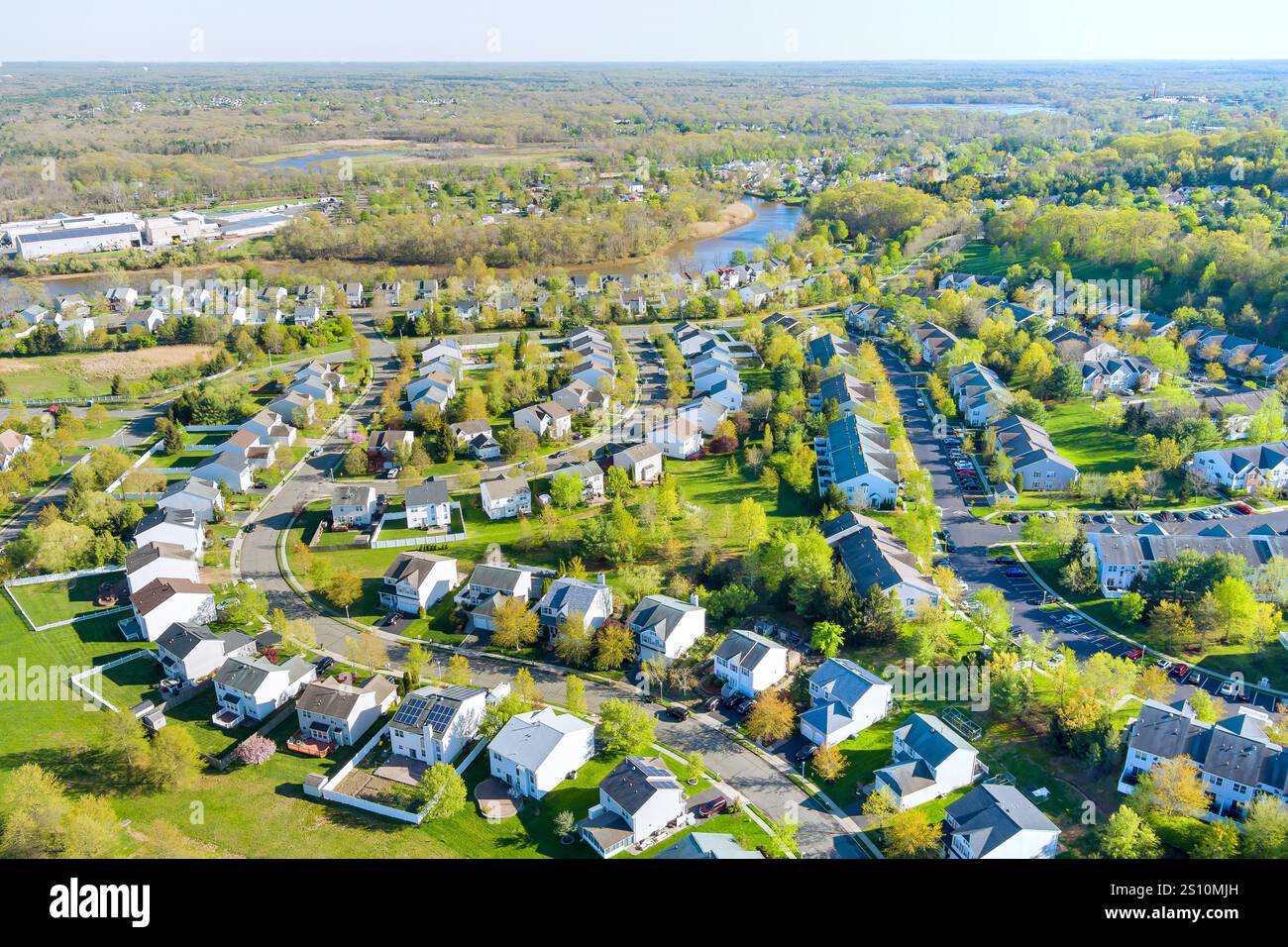 Aerial view captures suburban neighborhood filled with houses, streets ...