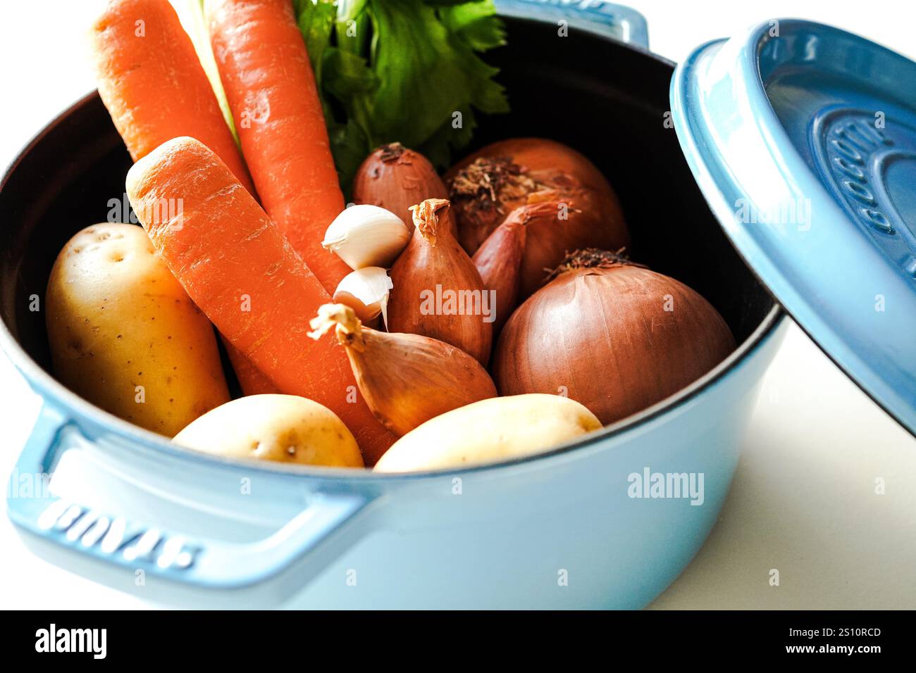 Healthy stew image, Stuab Cocotte blue enameled cast iron pot on white ...
