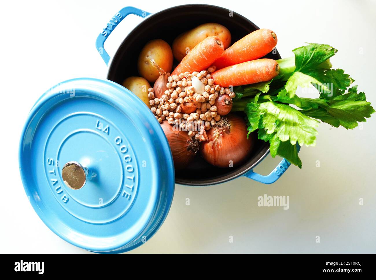 Healthy stew image, Stuab Cocotte blue enameled cast iron pot on white ...
