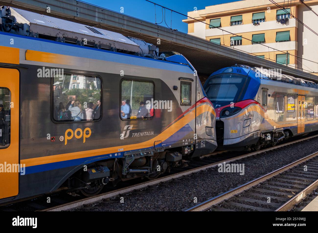 Two Trenitalia Pop passenger trains nose to nose at the station in ...