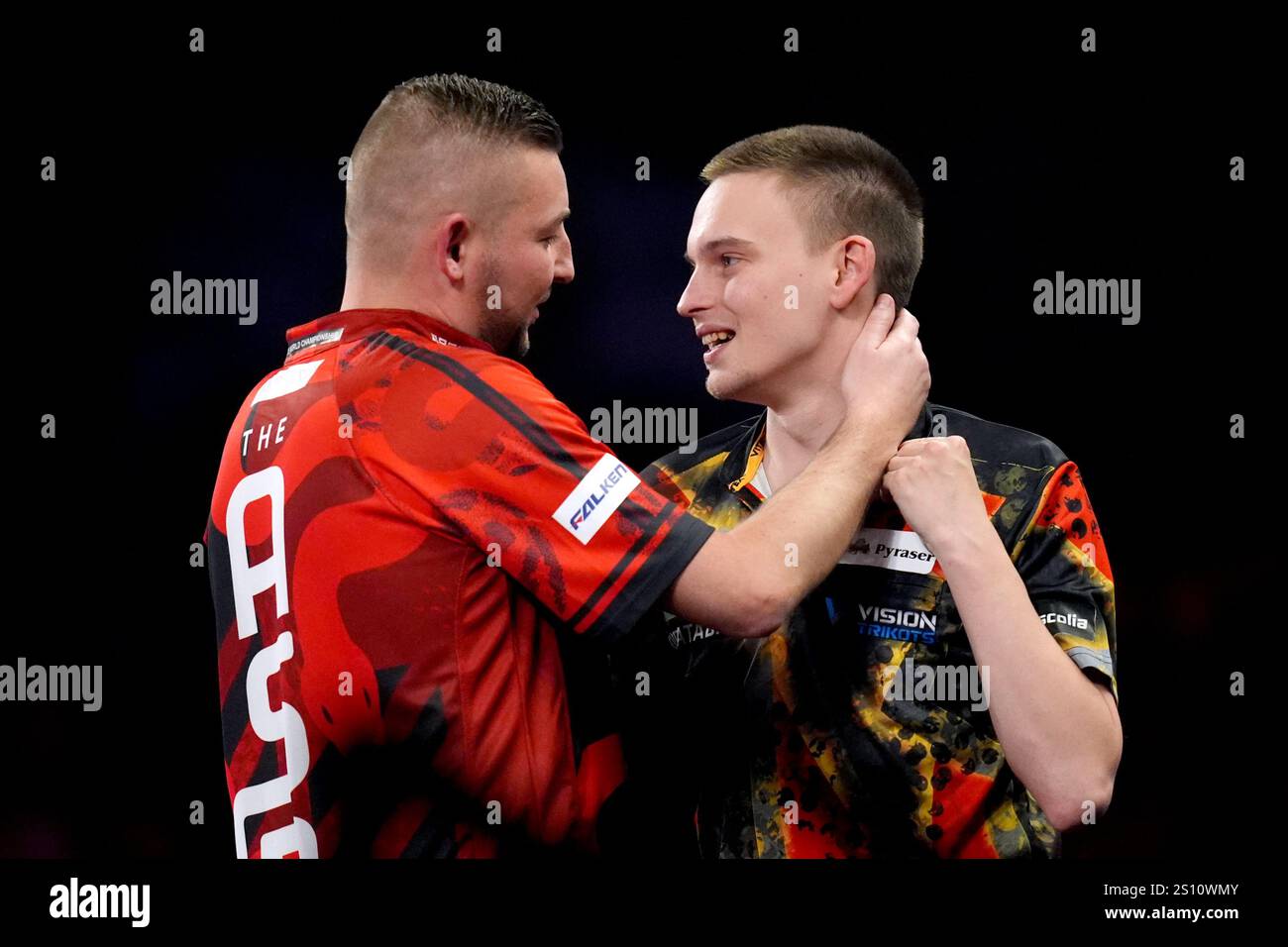 Ricardo Pietreczko (right) congratulates Nathan Aspinall on his victory ...