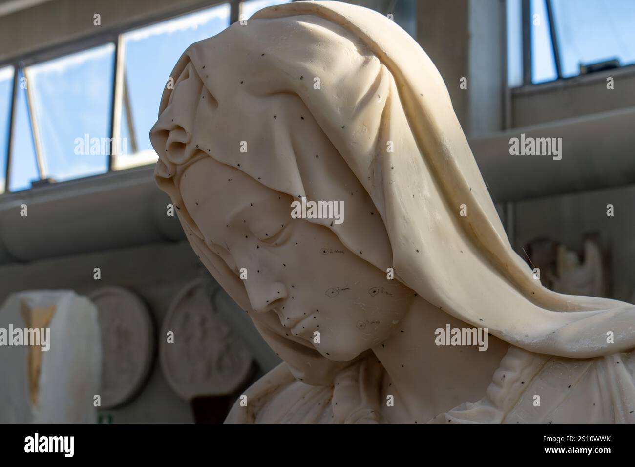 A cast resin model with reference marks in a carving studio in Carrara ...