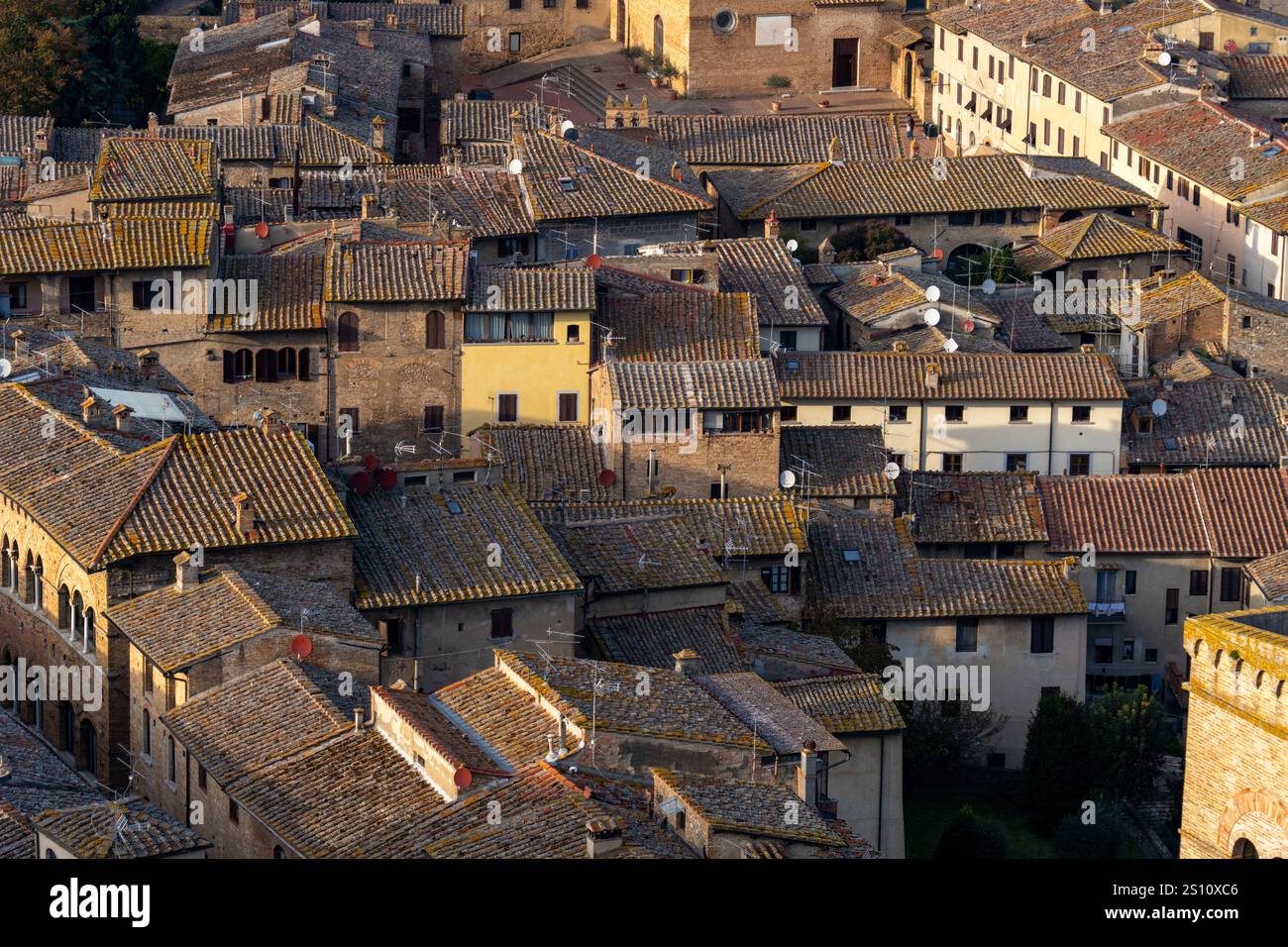 Traditional clay tile rooftops of the medieval buildings in the walled ...