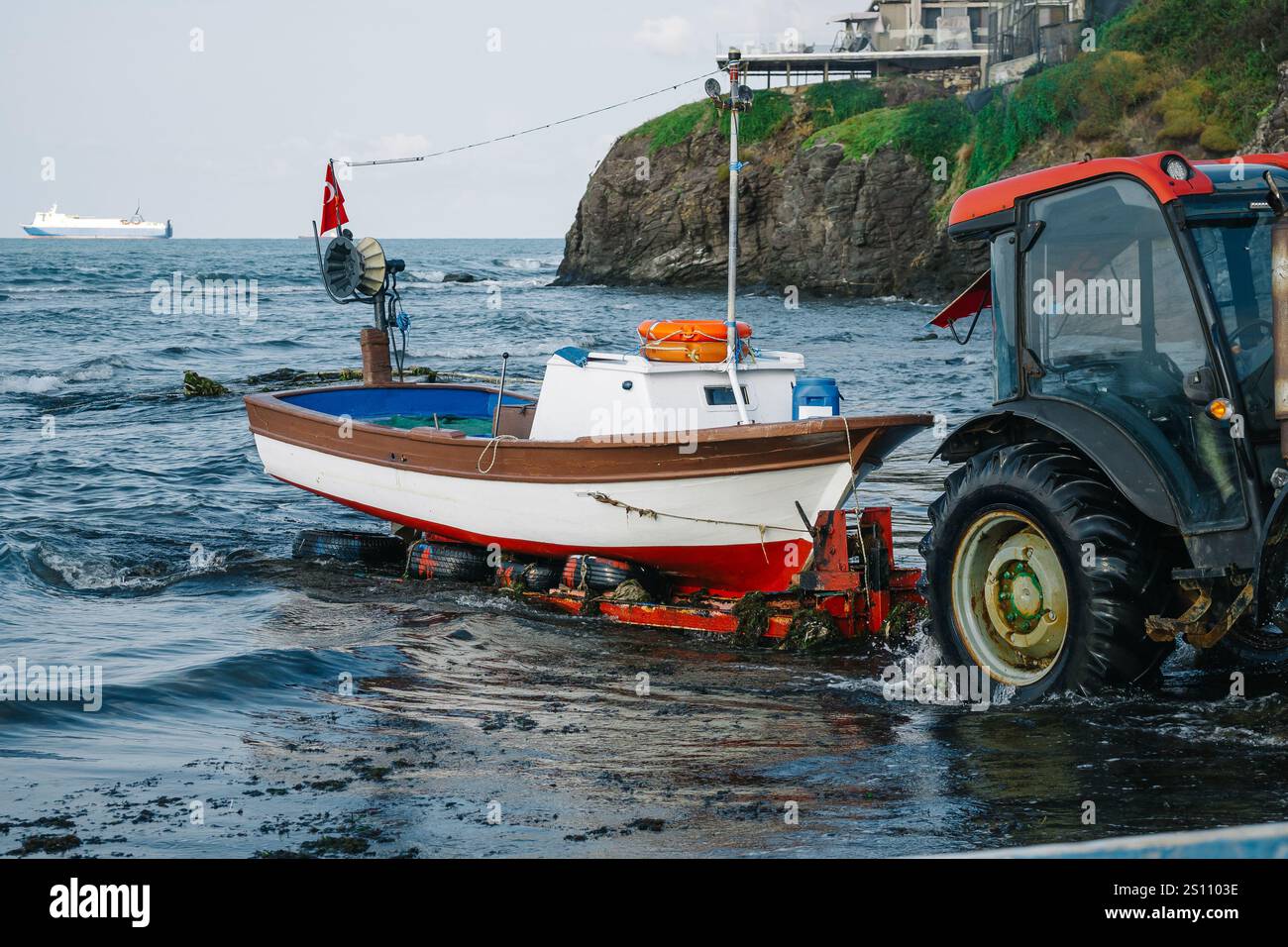 unloading the boat on the shore. pulling the boat to the beach for ...