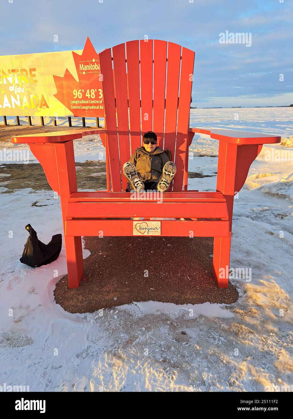 Red oversize Adirondack chair at the longitudinal centre of Canada in ...