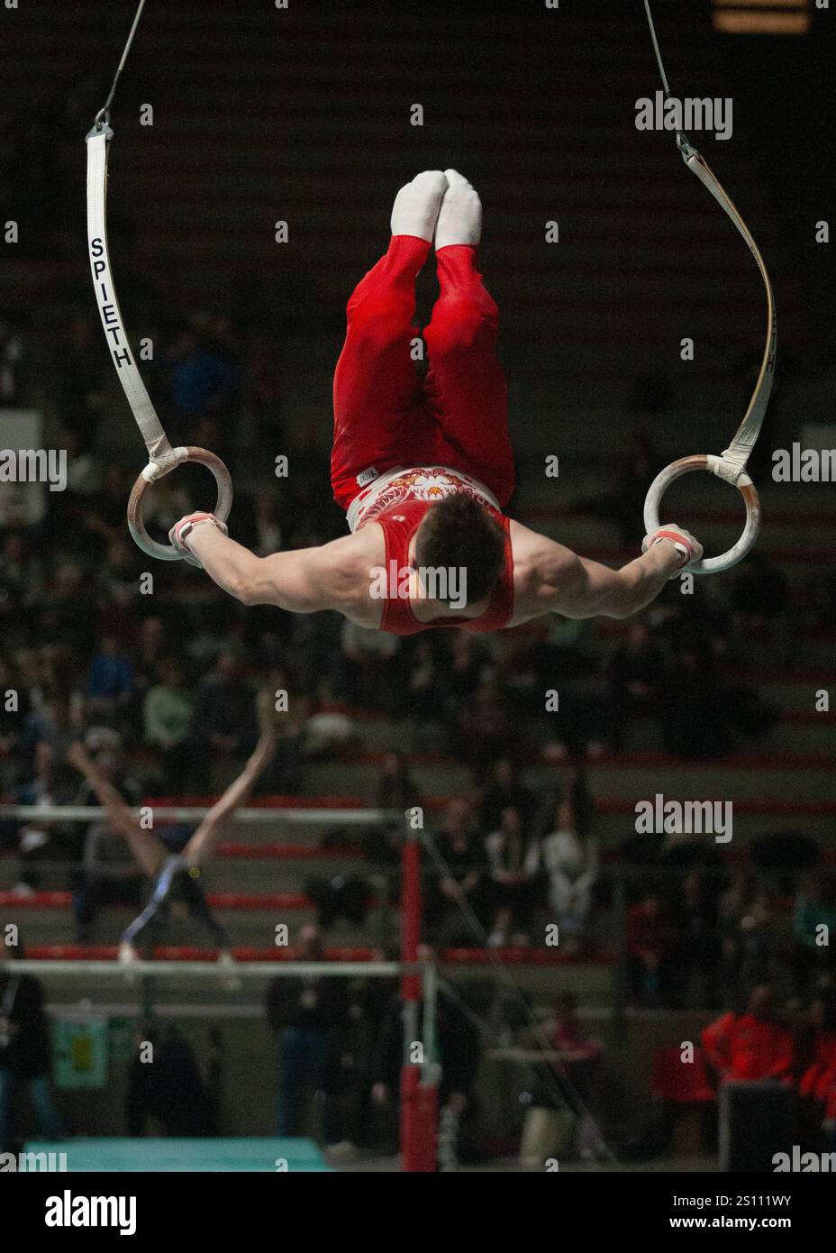 Gymnast performing a rings routine in a competition Ancona (Italy) 2024 ...