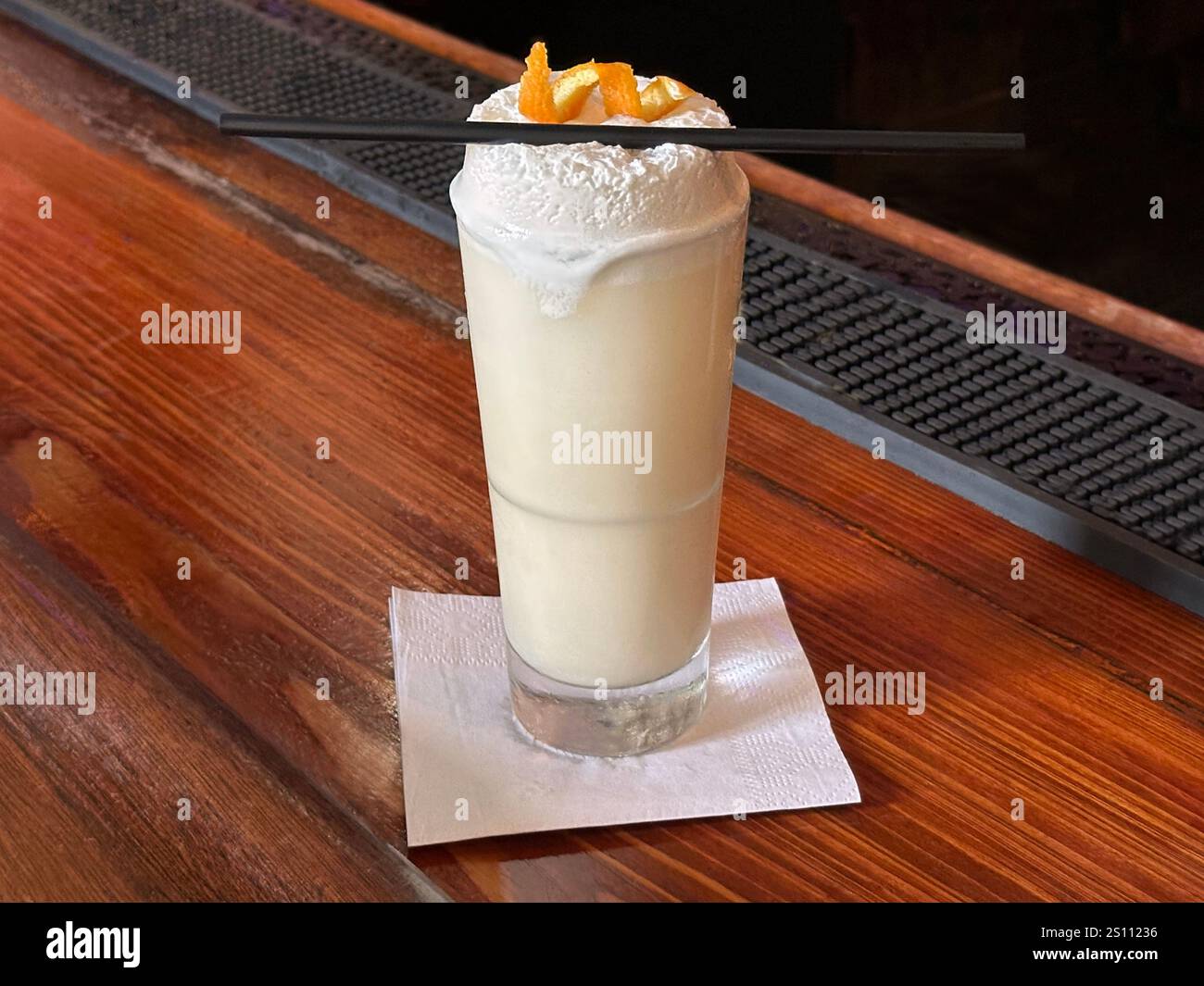 A Ramos gin fizz (AKA New Orleans fizz) cocktail is shown at a cocktail ...