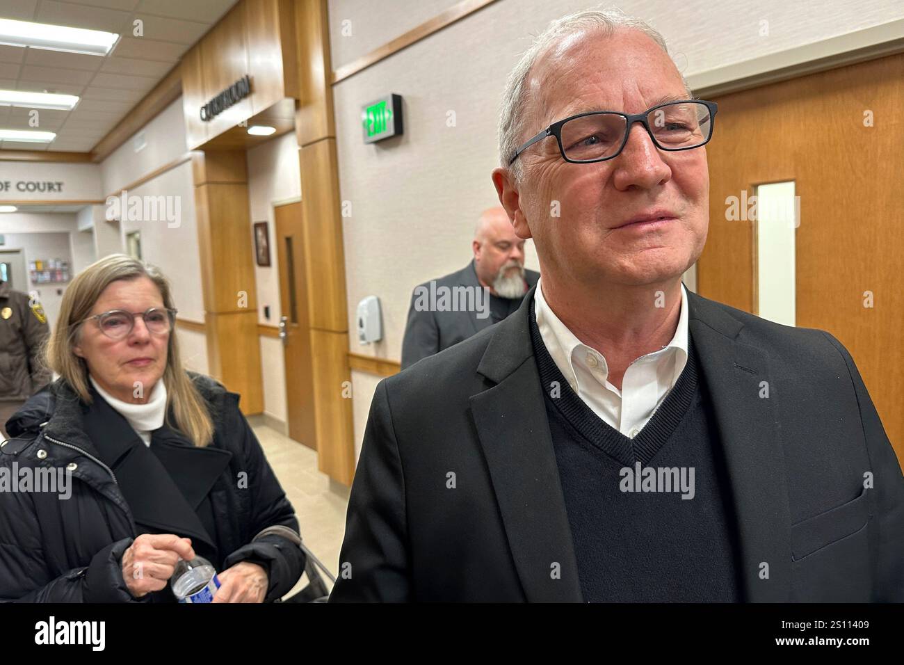 U.S. Sen. Kevin Cramer, R-N.D., speaks to reporters as his wife Kris ...