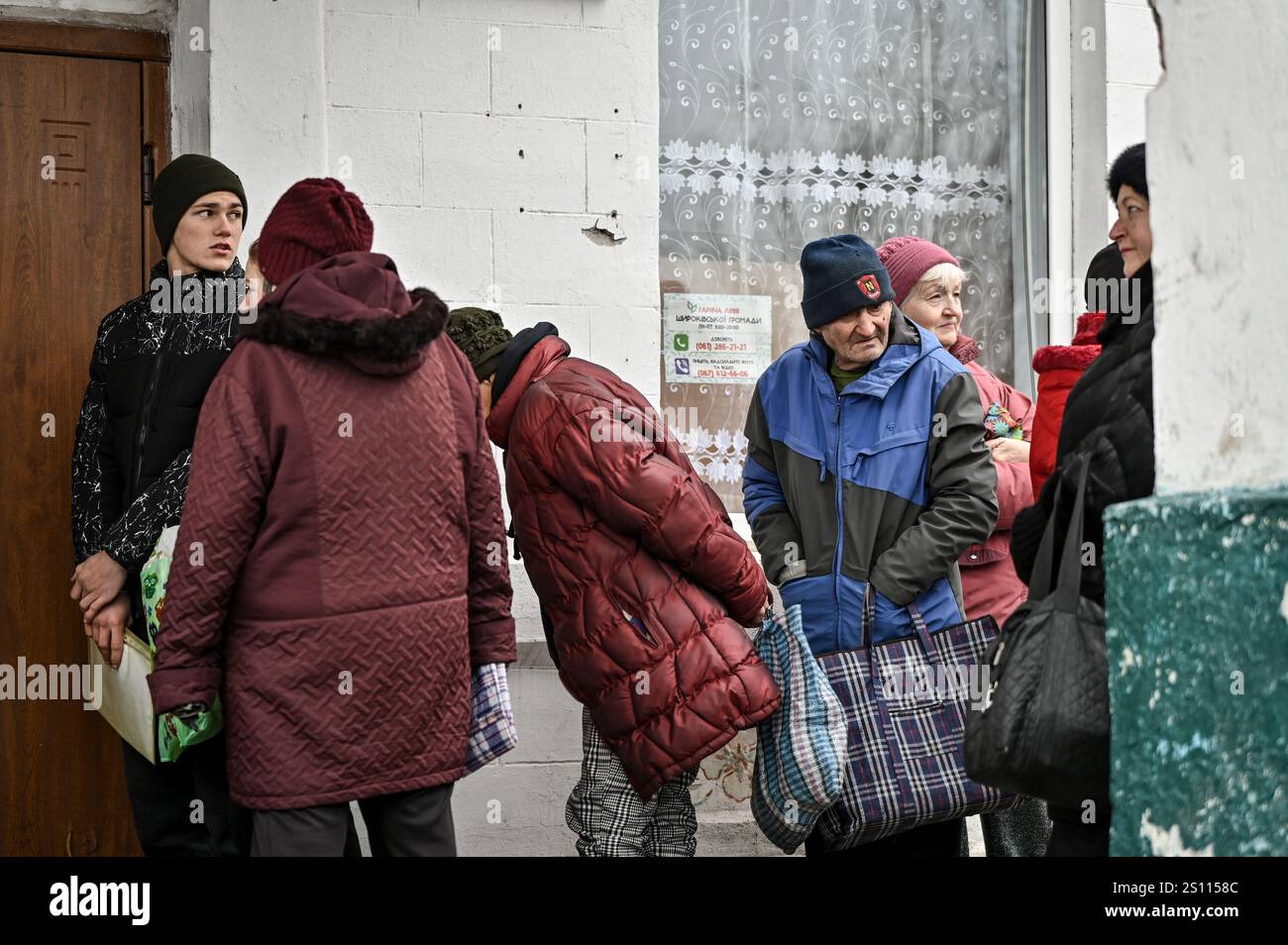 ZAPORIZHZHIA REGION, UKRAINE - DECEMBER 27, 2024 - Local residents ...