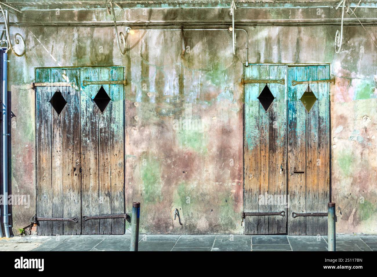 old rotten wooden doors with peeling color in the historic district of ...