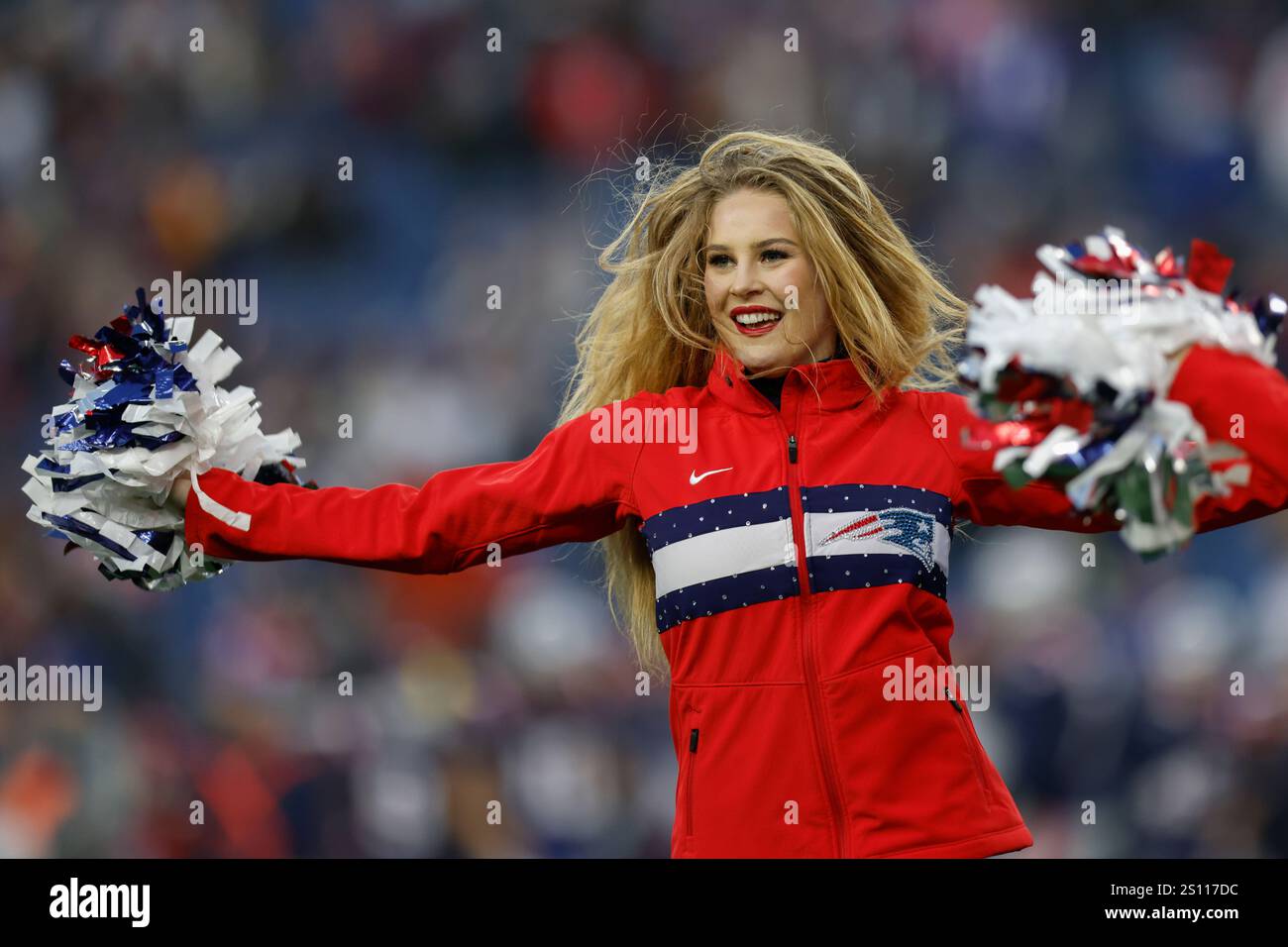 A New England Patriots cheerleader performs during the second half an ...