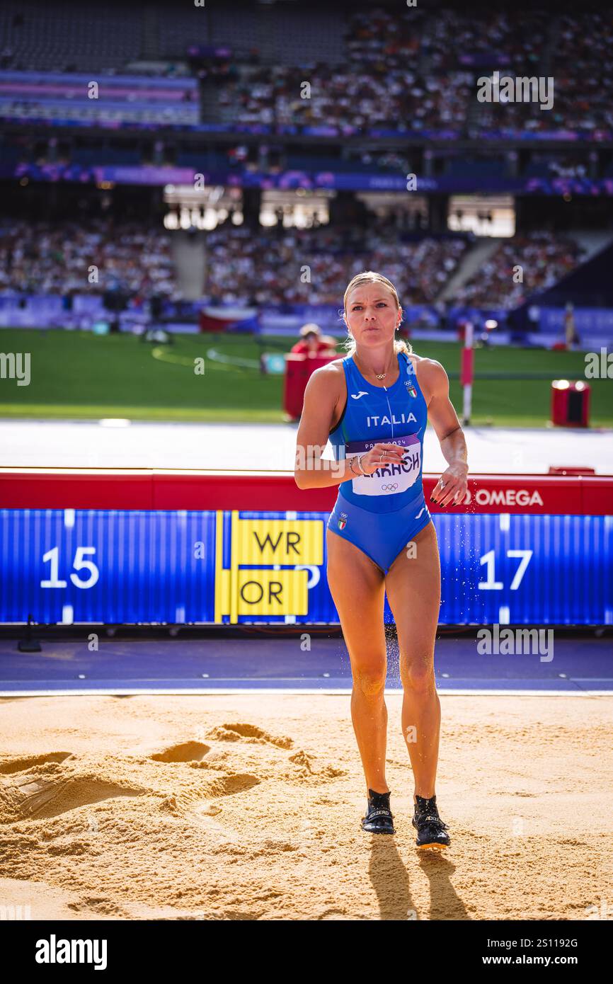 Dariya Derkach participating in the triple jump at the Paris 2024 ...