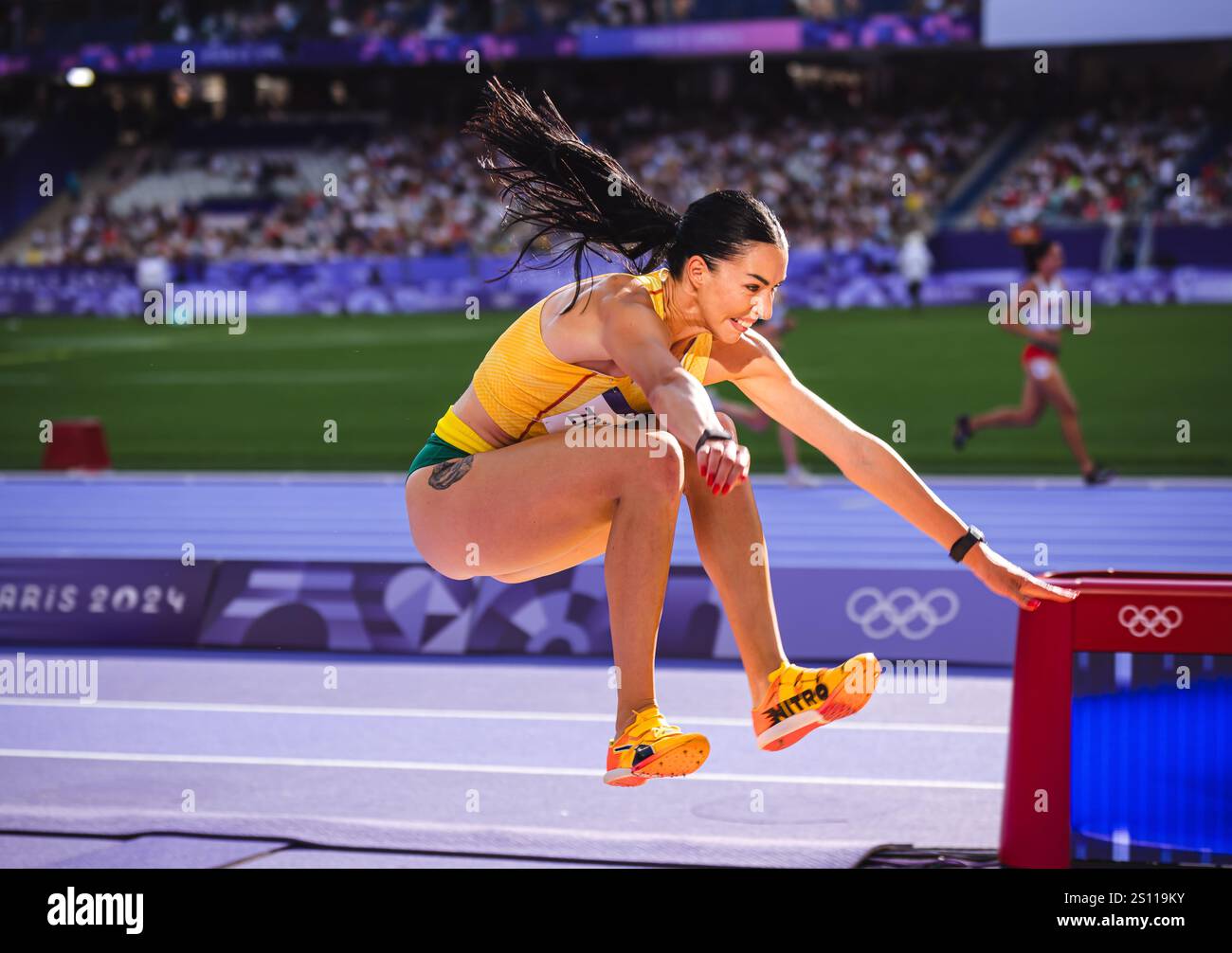 Diana Zagainova participating in the triple jump at the Paris 2024 ...