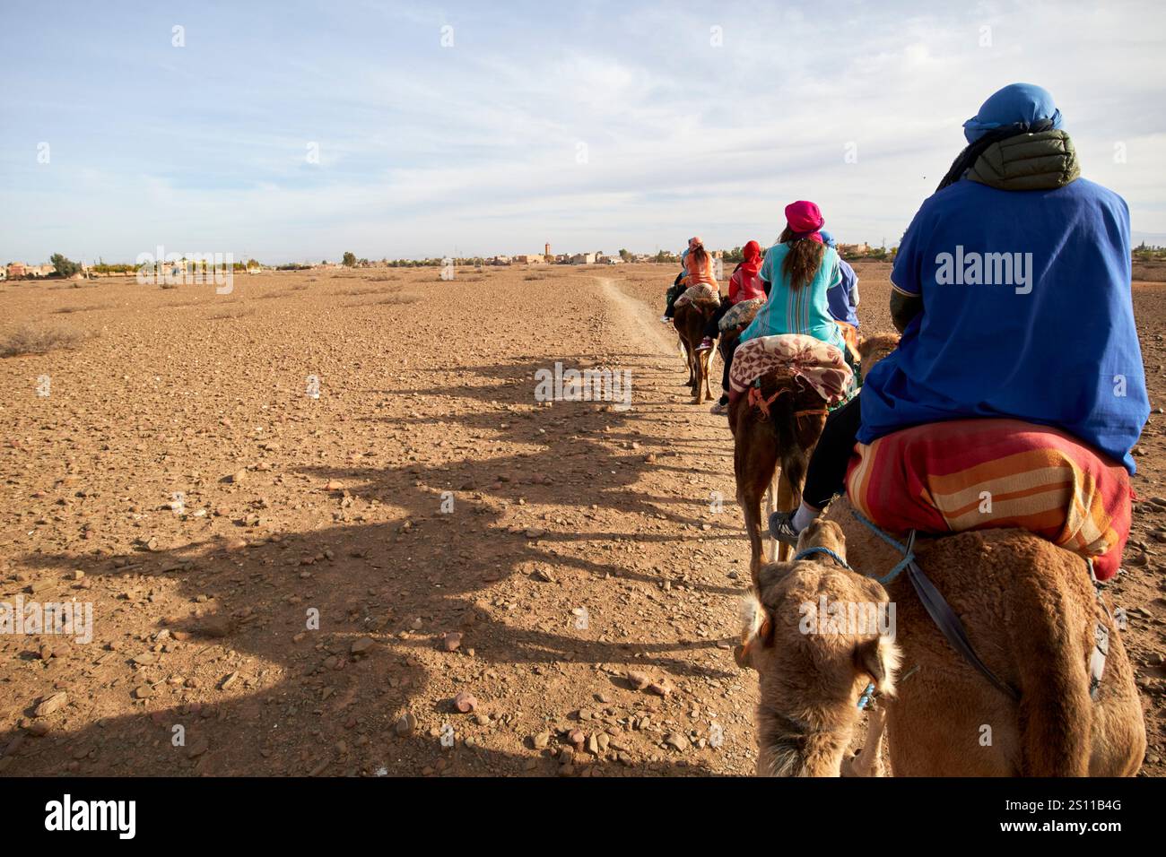 tour group on a camel ride experience douar bou azza morocco Stock ...