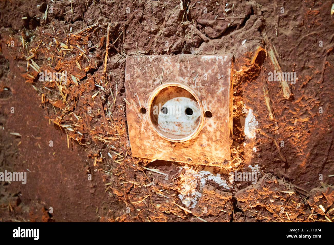 modern 2 pin electric socket in traditional mud and wood framed berber ...