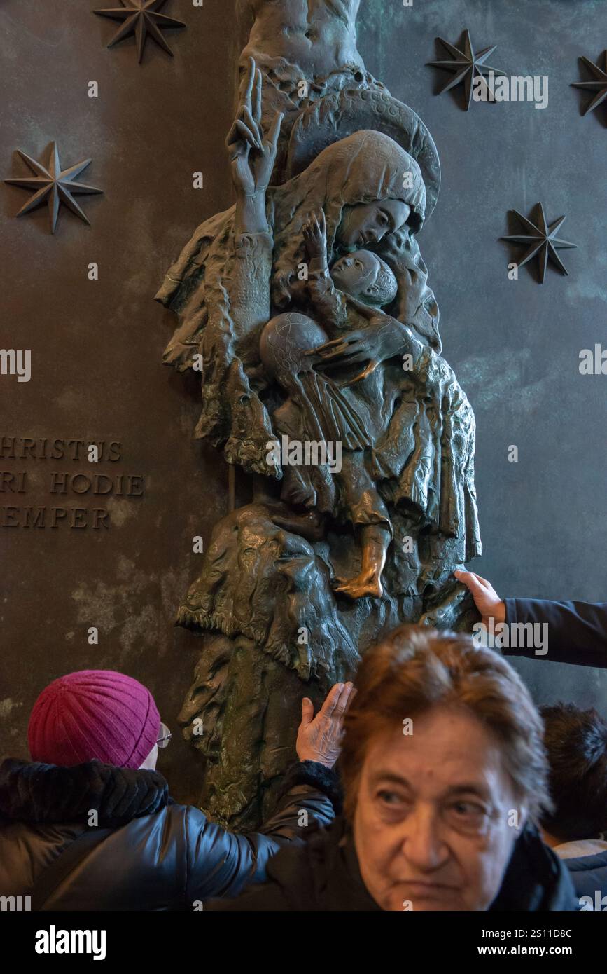 December 30, 2024 - Rome, Italy: Pilgrims pass through the Holy Door of ...