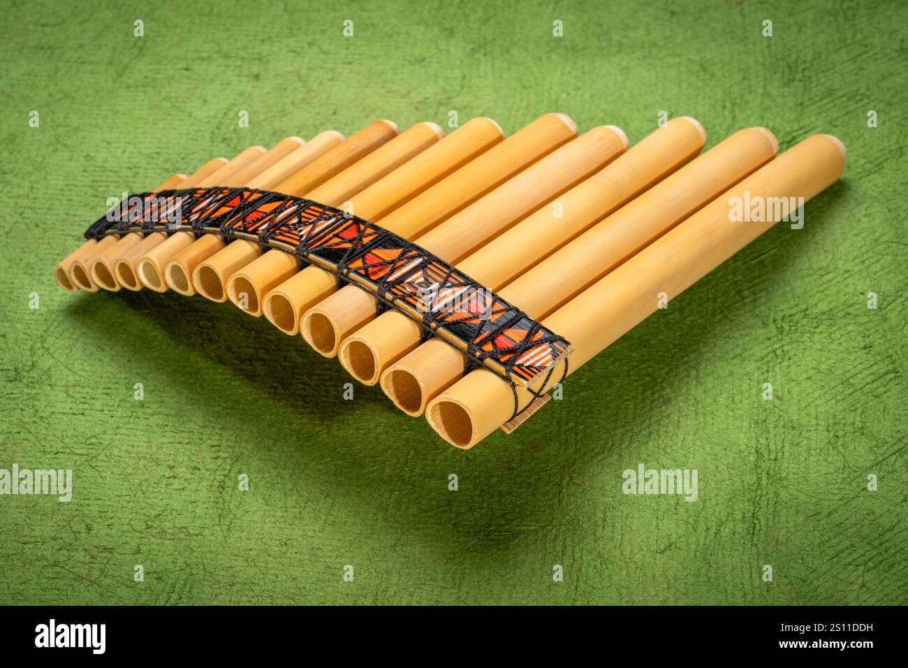 bamboo pan flute instrument from Peru against textured art paper Stock ...