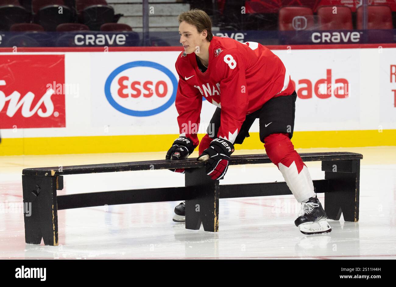 Ottawa, Canada. 30th Dec, 2024. Canada defenceman Beau Akey slides a ...